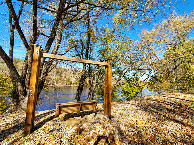 Nature's perfect reading nook&mdash;a riverside swing framed by golden leaves. Shakespeare himself couldn't have designed a better spot for contemplation.