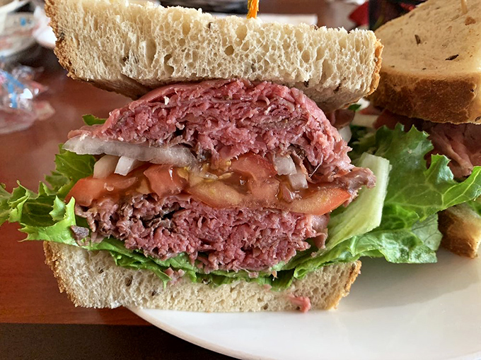 Roast beef piled high on fresh rye bread, proving that sometimes simple combinations create the most memorable experiences.
