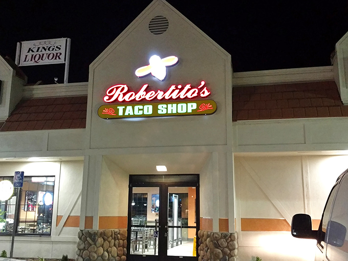 Robertito's neon sign beckons night owls with promises of late-night tacos. Some culinary traditions transcend all cultural boundaries.