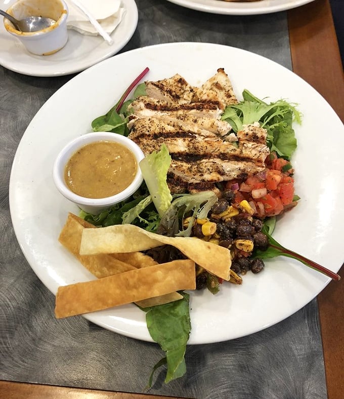 A salad that doesn't apologize for being healthy &ndash; grilled chicken, fresh greens, and crispy tortilla strips create a lunch option that satisfies without inducing a food coma.