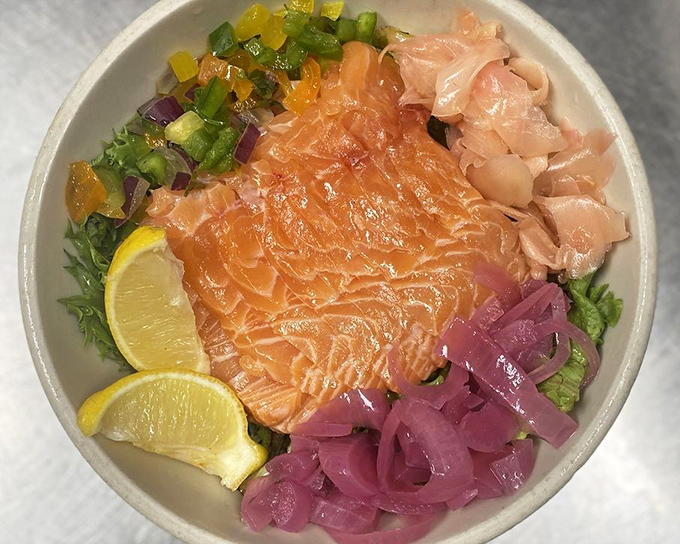 This salmon bowl brings together the vibrant colors of fresh fish, pickled onions, and citrus in a harmony that's as beautiful to look at as it is to eat.