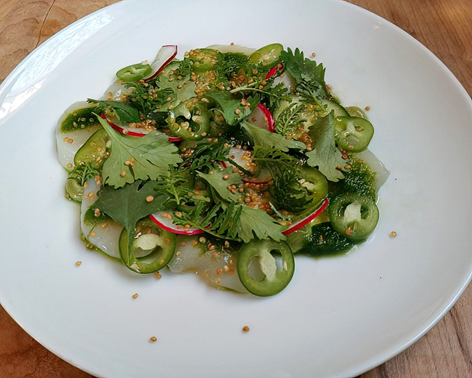 A verdant celebration on a plate &ndash; this scallop aguachil&eacute; dances with jalape&ntilde;os and radishes in a symphony of colors that taste as vibrant as they look.
