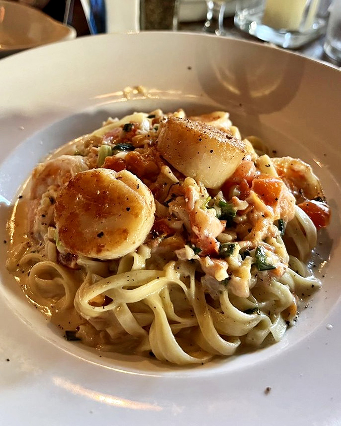 Linguine that's essentially a seafood treasure hunt. Each twirl of pasta potentially revealing scallops or shrimp like delicious buried treasure.