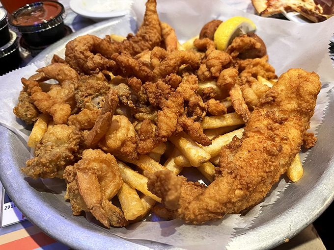 A fried seafood platter that makes sharing both necessary and nearly impossible—prepare to defend your portion.