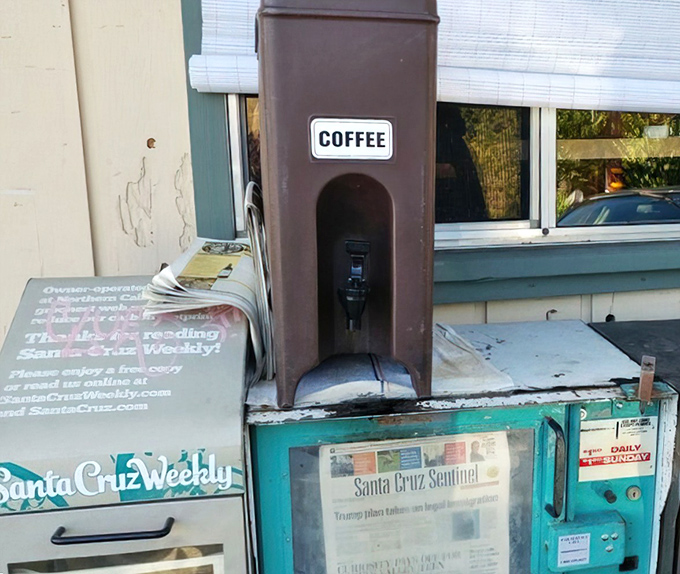 The newspaper stand and self-serve coffee station outside&mdash;a time portal to when "morning ritual" meant more than checking your phone.