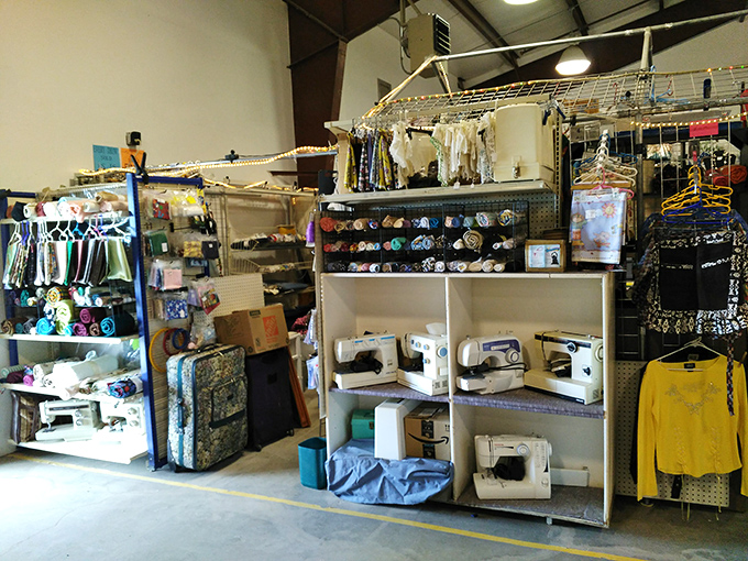 Sewing machines stand at attention like mechanical sentinels guarding a crafter's paradise of fabrics, notions, and creative possibilities.