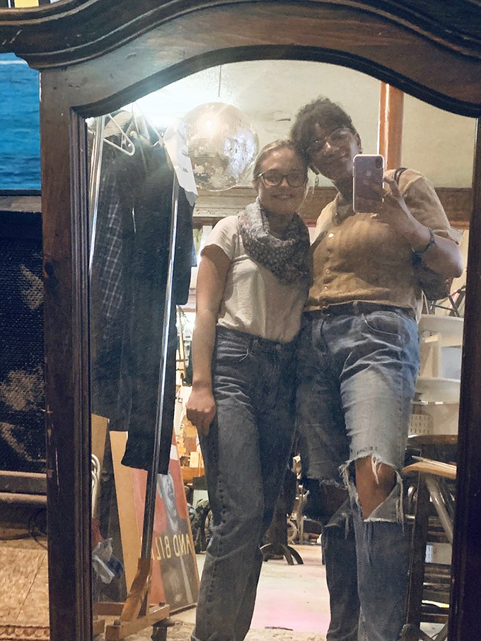 The mirror reflects not just shoppers but the cyclical nature of fashion—yesterday's castoffs becoming tomorrow's vintage statement pieces.