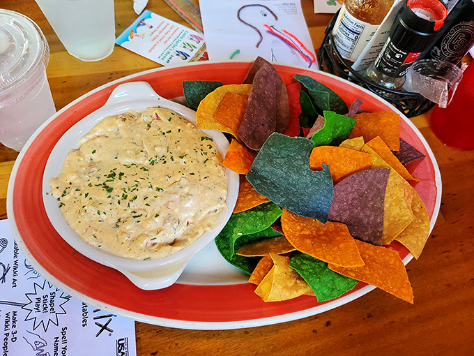 This seafood dip surrounded by technicolor tortilla chips isn't just an appetizer—it's the opening act to a memorable Gulf Coast feast.