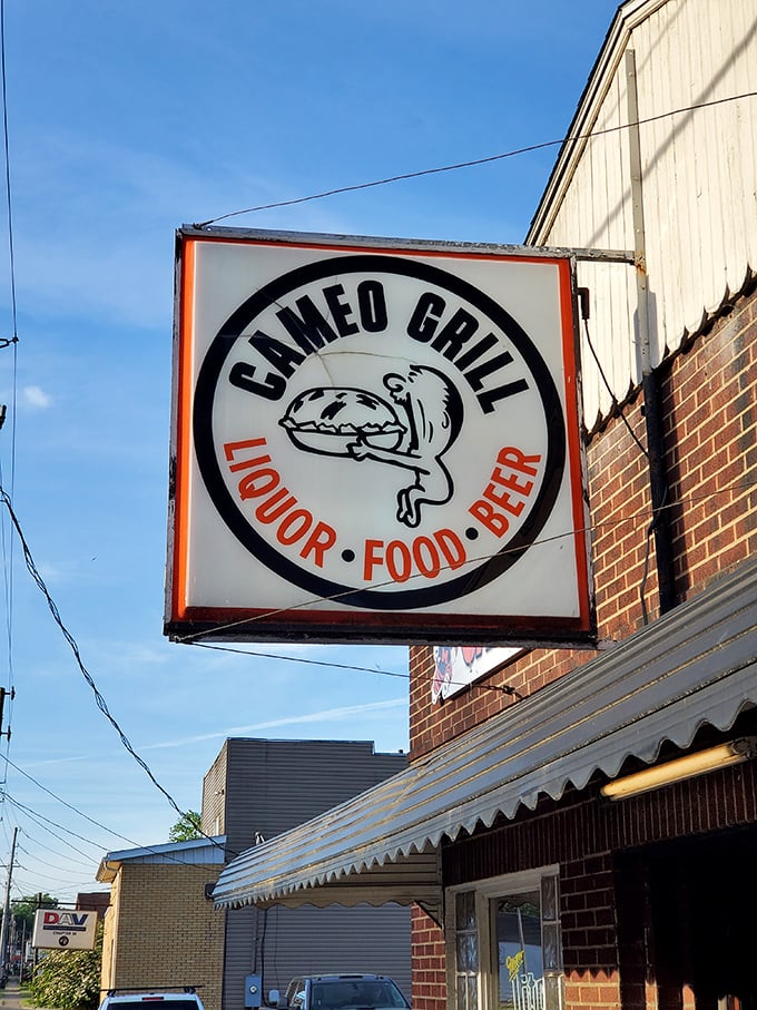 The iconic Cameo Grill sign promises the holy trinity of happiness—liquor, food, and beer—beneath a squirrel mascot clutching a sandwich.