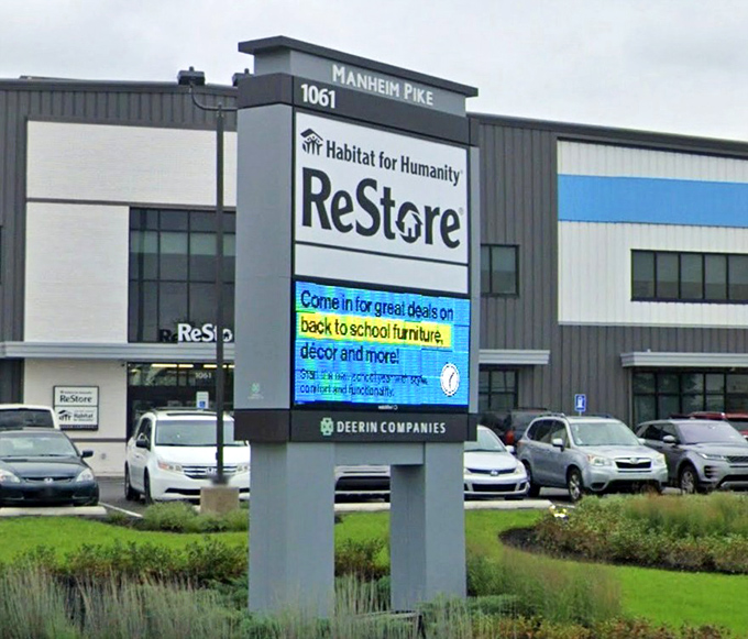 The Manheim Pike location announces seasonal deals with digital flair. School furniture in August? Perfect timing for the home office upgrade!