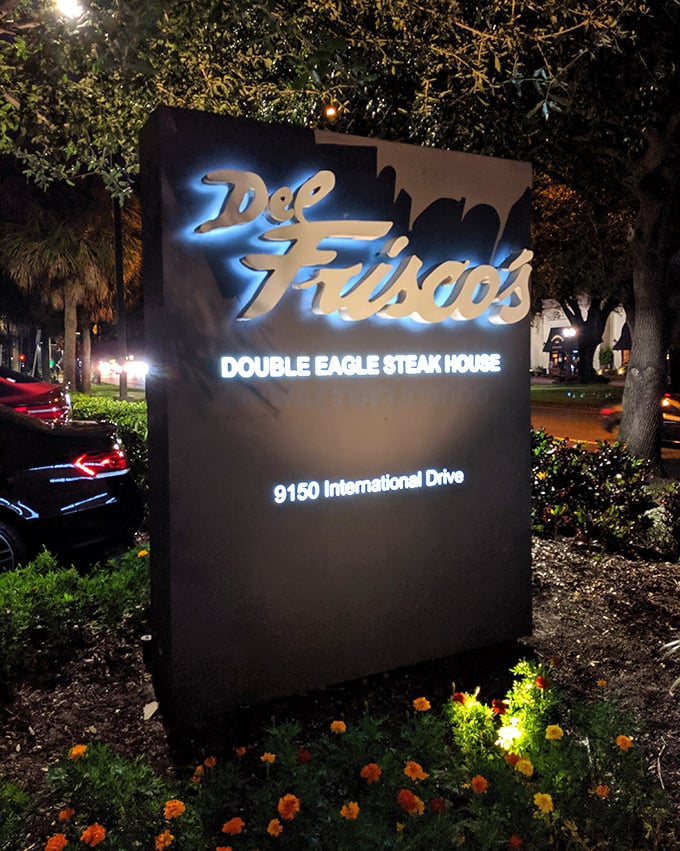 The illuminated signage glows like a beacon for beef lovers. In the darkness, it whispers, "This way to satisfaction."