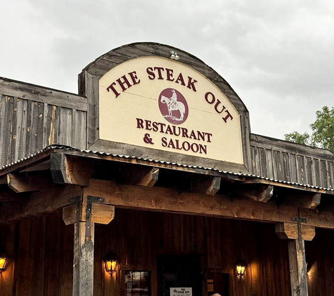 The iconic sign promises exactly what awaits inside: authentic Western hospitality and steaks worth traveling miles of desert roads to find.