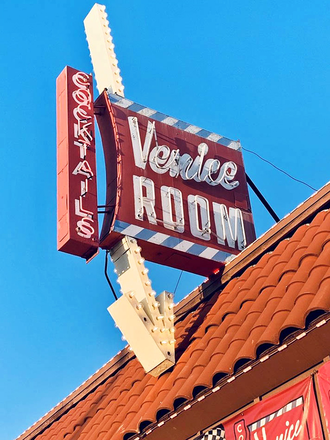 The Venice Room sign against a perfect California blue sky – a mid-century masterpiece that's outlasted countless dining trends.