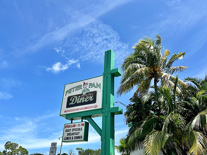 The Peter Pan sign against that perfect Florida sky reminds us that in the world of comfort food, we never have to grow up.