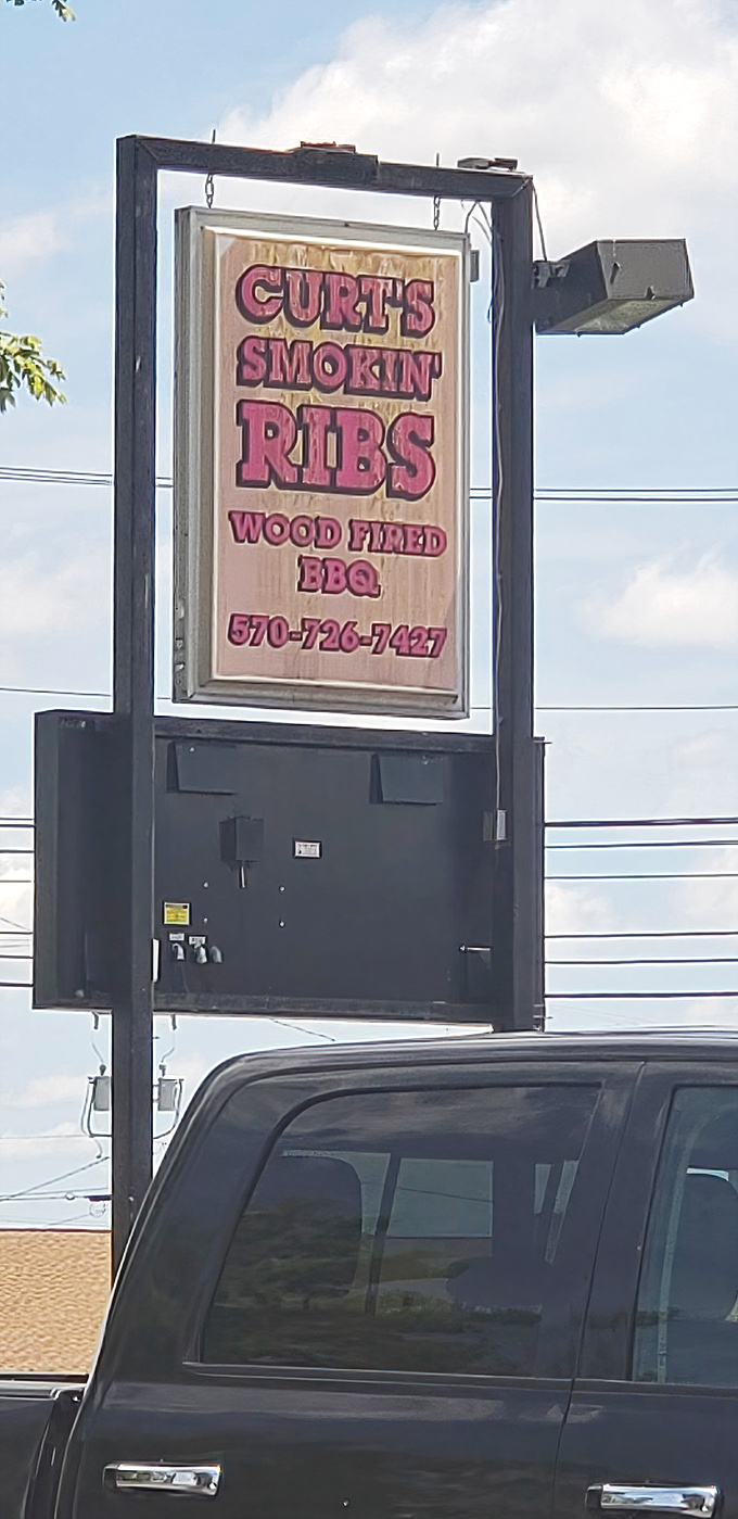 The roadside sign&mdash;a beacon of hope for hungry travelers and a landmark for locals giving directions.