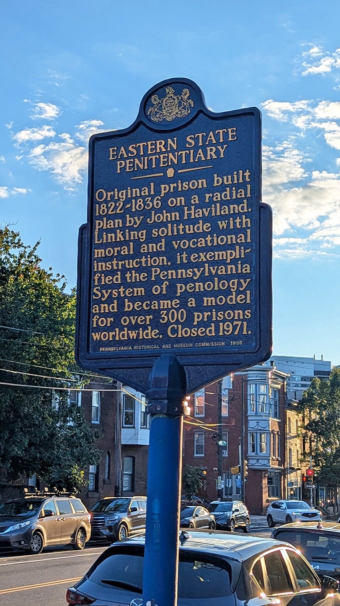 The historical marker tells Eastern State's origin story&mdash;a revolutionary concept in 1829 that influenced prison design worldwide for generations to come.