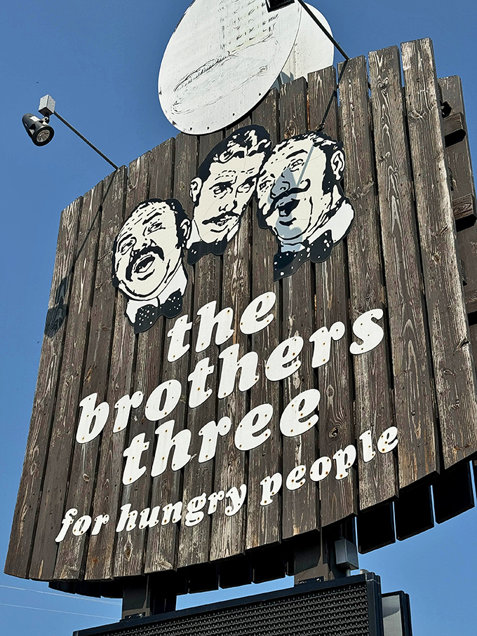 That iconic sign with three dapper gentlemen in bow ties – a Marinette landmark that's guided hungry travelers like a culinary lighthouse for decades.