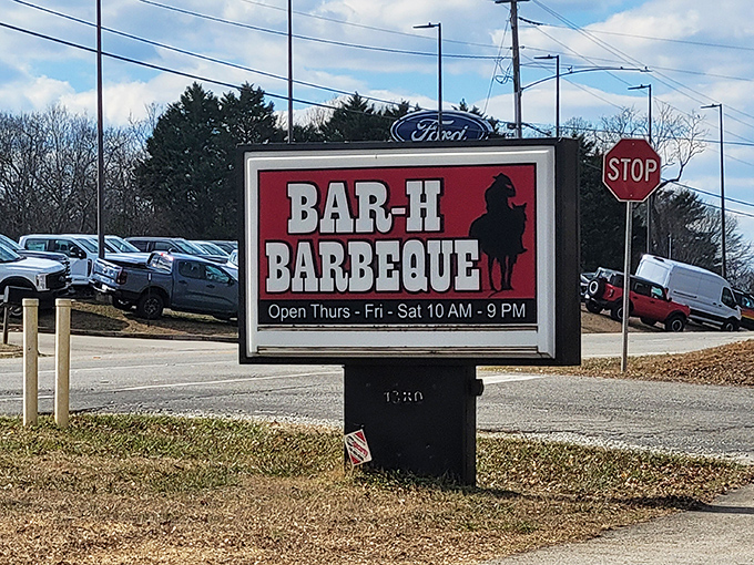 The roadside sign stands like a beacon of hope for hungry travelers. Those three days of operation feel like winning the barbecue lottery.