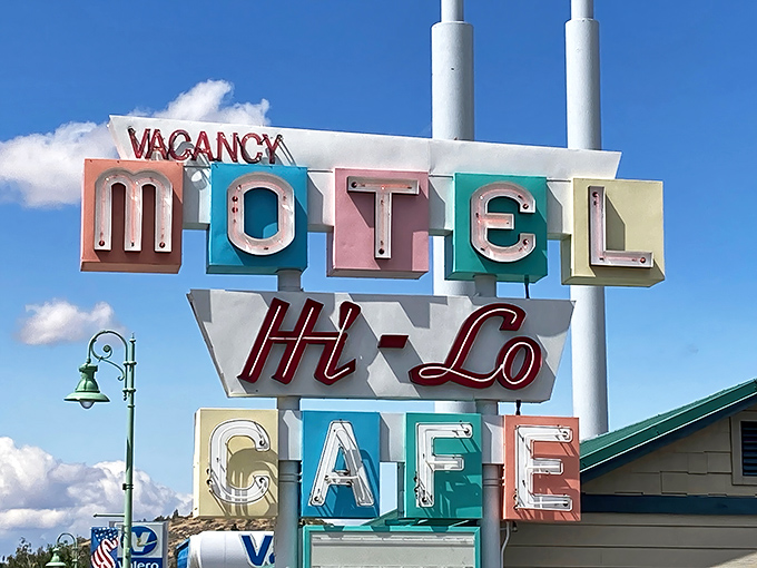 The vintage Hi-Lo sign stands as a colorful beacon for hungry travelers&mdash;part roadside Americana, part promise of good things to come.
