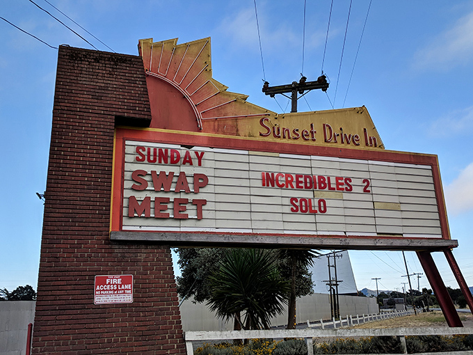 Bold signage announces tonight's features like a town crier of entertainment, visible from the highway.