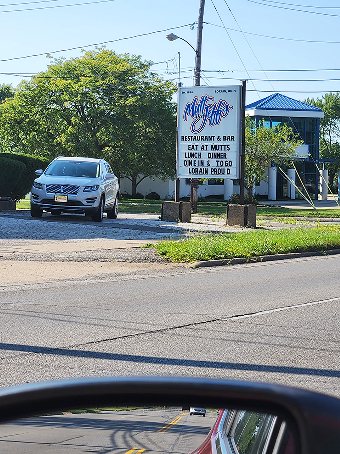 "Lorain Proud" declares the roadside sign, standing sentinel over a parking lot that fills with hungry pilgrims seeking burger enlightenment.