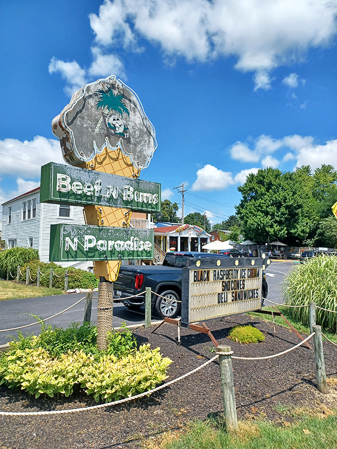 The towering ice cream cone sign beckons travelers like a delicious lighthouse on hungry seas.