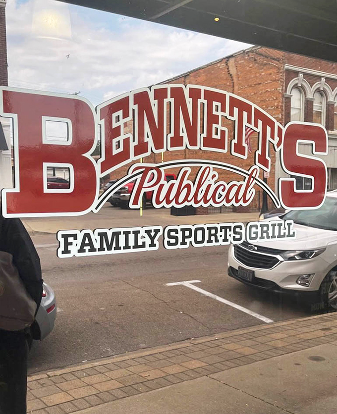 The bold red lettering of Bennett's Publical against historic brick is more than signage&mdash;it's a promise of good times and better food ahead.