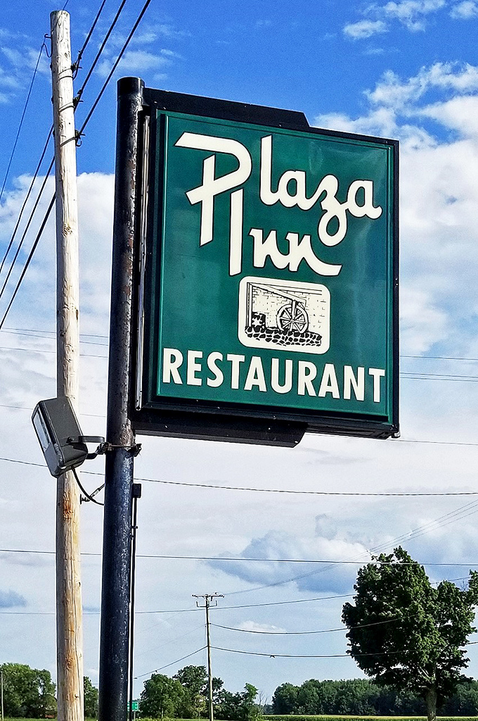 The roadside sign stands as a beacon for hungry travelers. Like a lighthouse, but instead of avoiding rocks, you're steered toward rolls.