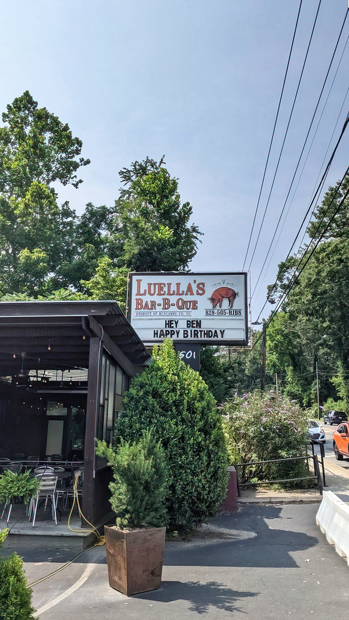 The roadside sign doesn't just mark a restaurant—it's a landmark on the map of memorable meals.