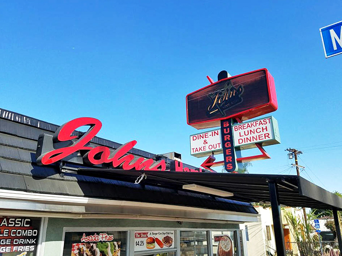 The sign against the California blue sky&mdash;a landmark that says "turn here for happiness" more effectively than any GPS ever could.