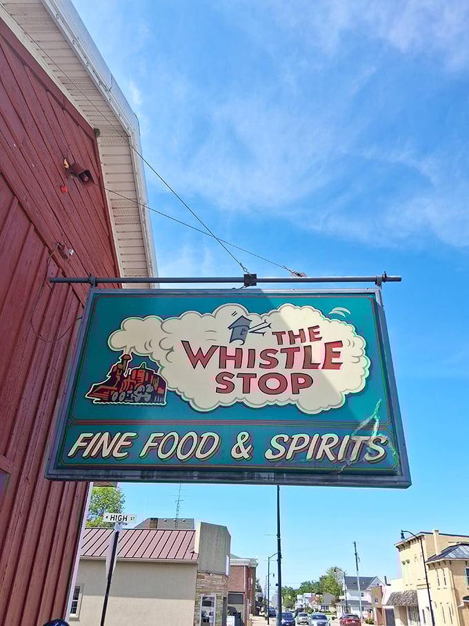 The sign says "Fine Food & Spirits," but what it really means is "Come in, relax, and forget your troubles." That little train knows what's up.