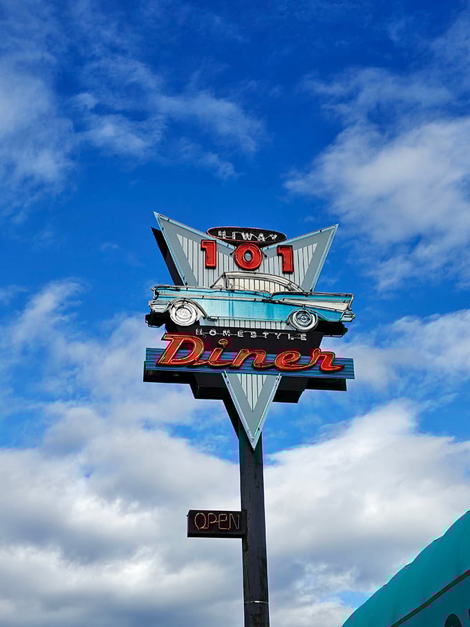 Against that perfect Washington blue sky, the neon sign stands like a beacon of hope for hungry travelers seeking refuge from chain restaurants.