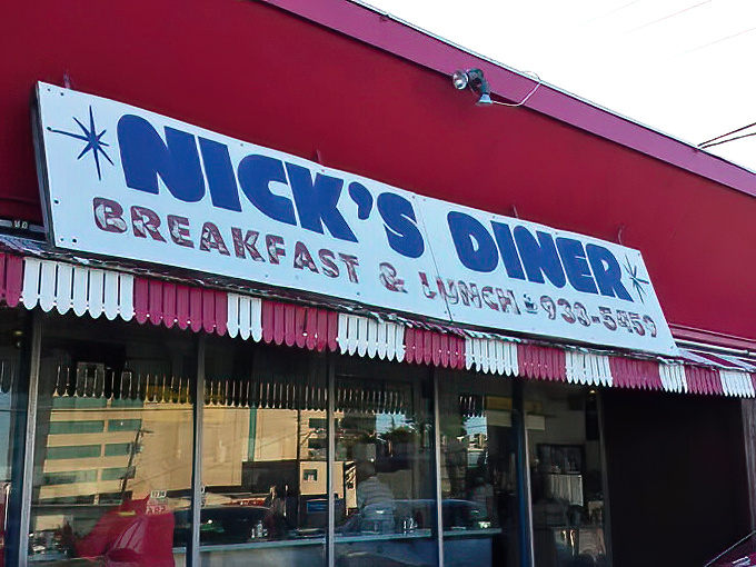 The sign promises "Breakfast & Lunch" but what it really means is "We'll make your day better, one plate at a time."