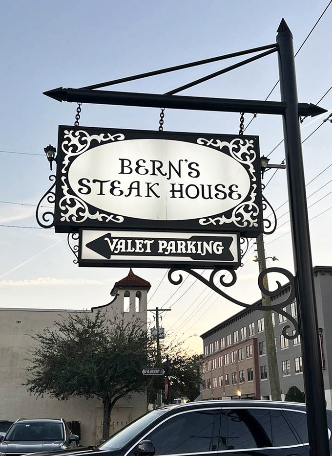 The sign promises valet parking, but what it really offers is entry into a parallel universe where dinner becomes theater.