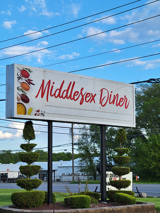 The roadside sign glows like a beacon of hope for hungry travelers. Those painted food icons are basically a Pennsylvania Rosetta Stone for "delicious inside."