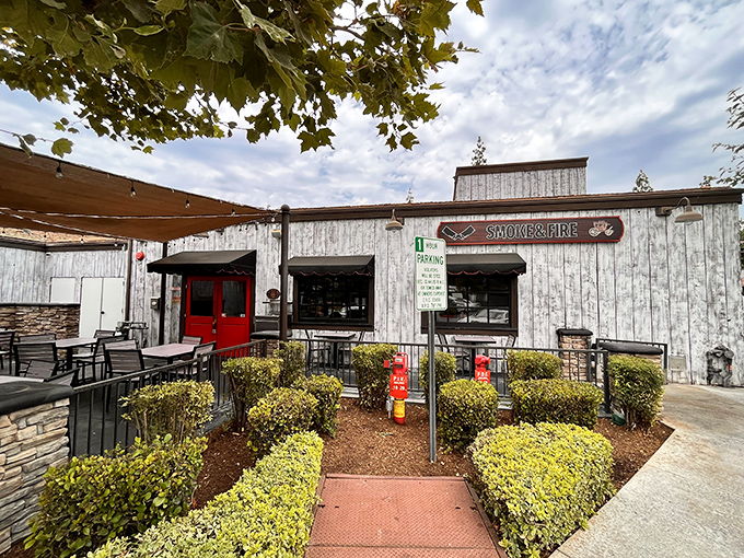 Smoke & Fire's rustic exterior hints at the primal, wood-fired delights waiting inside&mdash;where barbecue dreams come true.