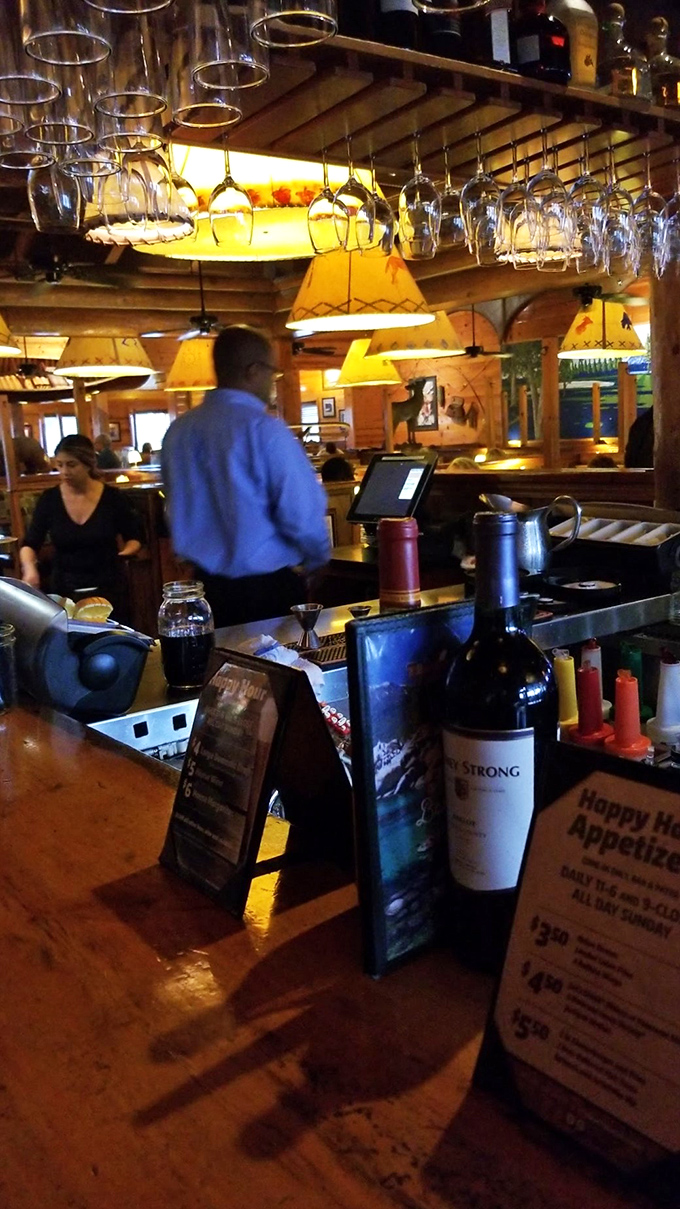 Where libations are crafted with care&mdash;the hanging glassware creating a chandelier effect that elevates the rustic surroundings.