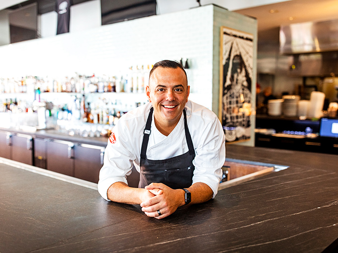 Behind every great restaurant is a passionate chef. That smile says, "Just wait until you taste what's coming out of my kitchen next."
