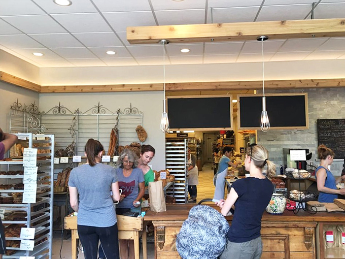 The sacred exchange: passionate bakers passing their creations to grateful customers in a timeless ritual of delicious commerce.