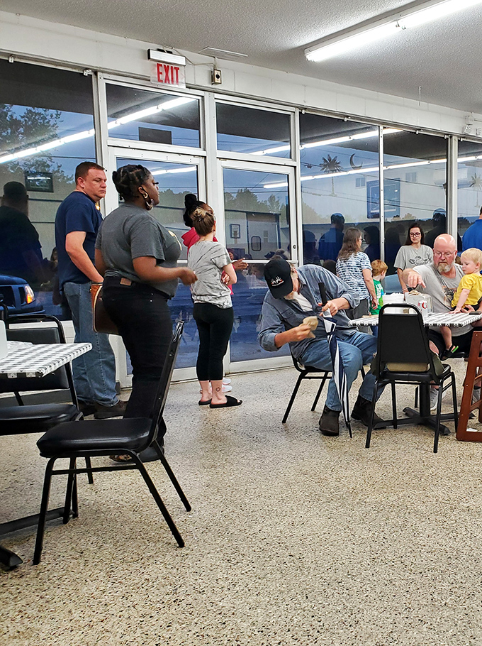 The dining room buzzes with conversation and satisfaction. That "Welcome" sign isn't just decoration&mdash;it's the restaurant's entire philosophy.