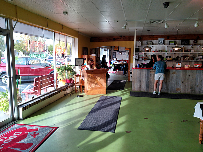 The entrance area&mdash;where hope begins and diet plans go to die. That green floor guides you to greatness.