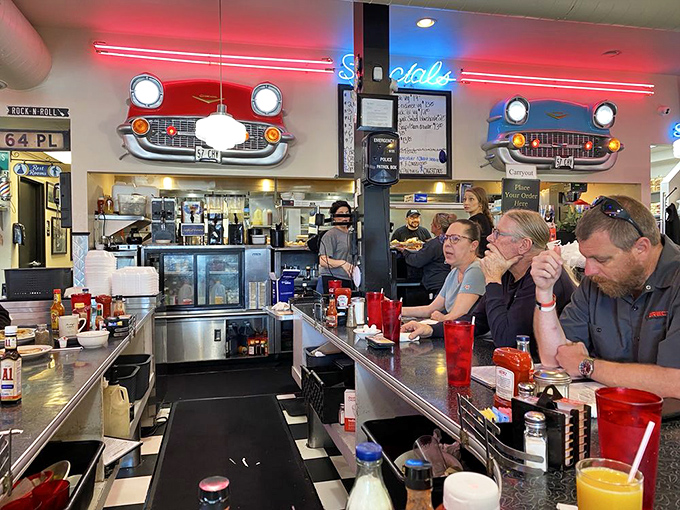 The counter at Tommy's: where coffee refills flow freely and the staff remembers how you like your eggs before you do.