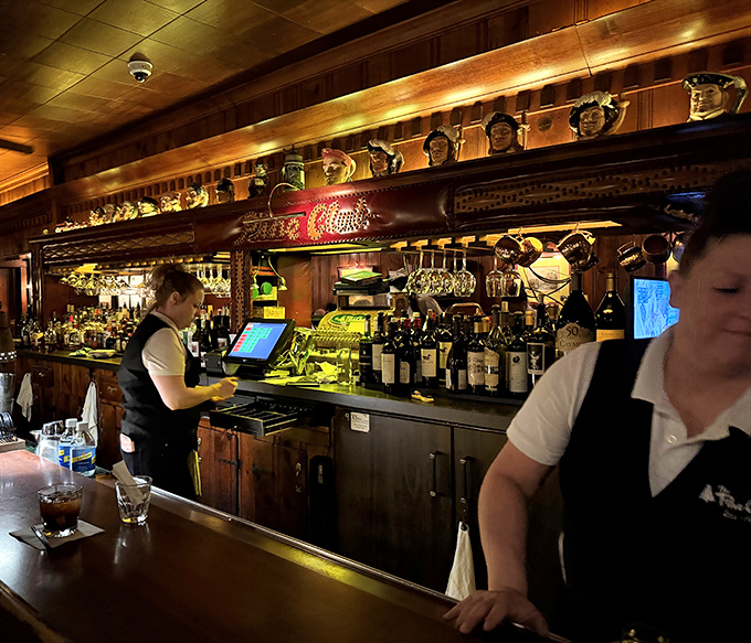 Behind the bar, skilled hands work with practiced efficiency &ndash; these aren't just servers, they're custodians of a dining tradition.