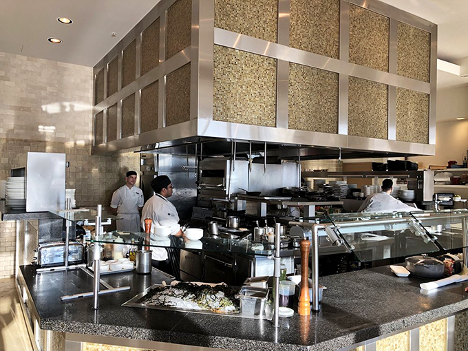 Behind every great seafood restaurant is a team that knows their way around a fish—precision and passion visible in this gleaming, well-orchestrated kitchen.
