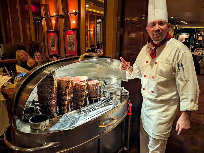 The carving cart arrives tableside with ceremonial importance, piloted by a chef who knows he's about to make your day significantly better.