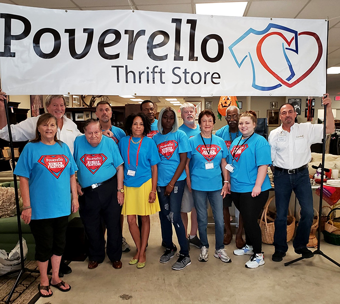 The superhero team behind Poverello's mission, wearing their commitment on their bright blue t-shirts. These volunteers transform donations into community support.