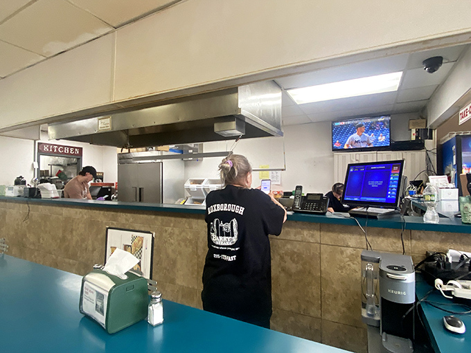 Where the magic happens: skilled hands transform simple ingredients into legendary sandwiches with movements honed through thousands of repetitions.
