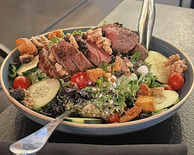 Steak salad that satisfies both your carnivorous cravings and health promises. Perfectly pink beef atop garden freshness&mdash;having it all.
