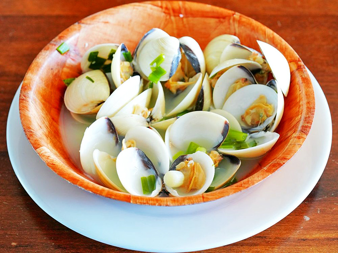 Steamed clams swimming in their own natural juices&mdash;oceanic simplicity that proves sometimes the best cooking means knowing when to stop.