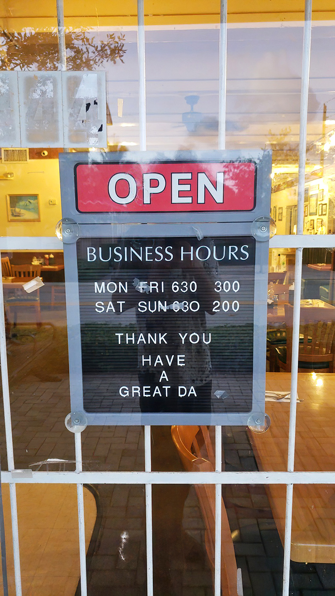 Business hours posted like a promise &ndash; early enough for sunrise seekers, open for weekend warriors.